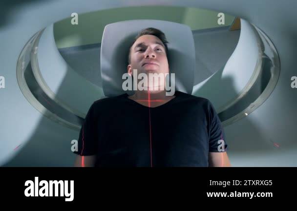 MRI scanning process carried out on a male patient Stock Video Footage ...