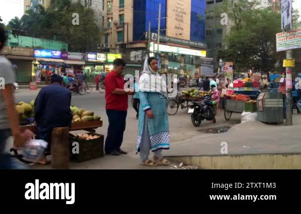 Unidentified people and street traffic at the Ring Road in the Adabor ...