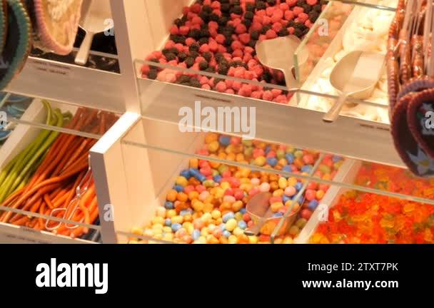 Assorted colorful jelly candies on counter at a food market store ...