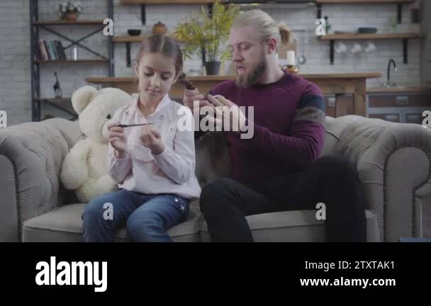 Brunette Teenage Caucasian Girl Filing Nails And Suddenly Looking Back