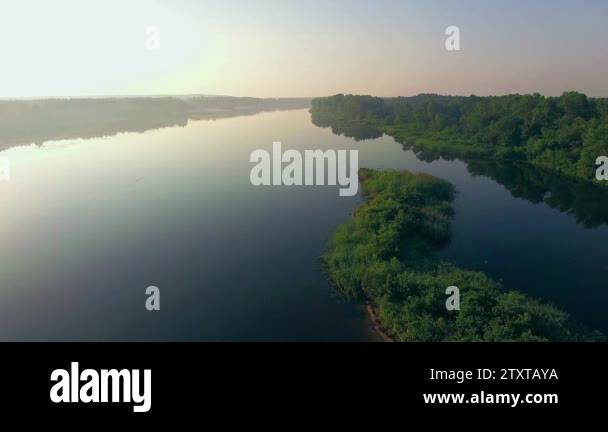 fly over island on the river 4K, 4K aeria view of island with reed ...