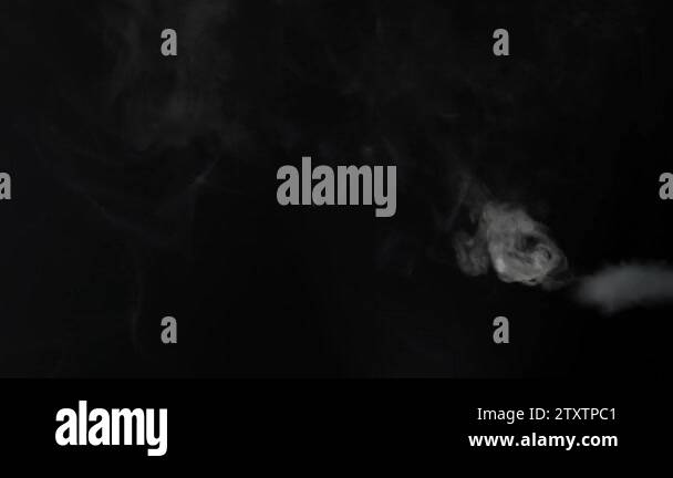 Vertically positioned white smoke over black background Stock Video ...