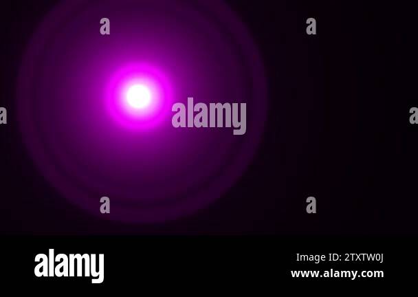 Purple digital lens flare with bright light in black background used ...