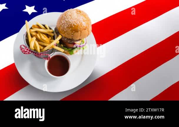 Digital composite of fast food plate with burger and fries against ...