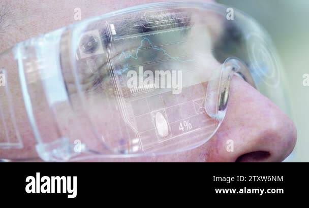 A man watches with a futuristic look with glasses augmented reality in ...