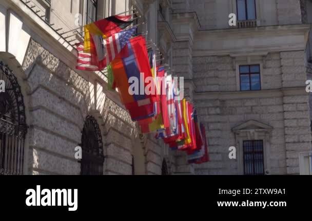 Flags of the OSCE participating States on the headquarters building in ...