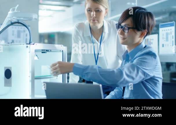 Two Talented Engineers Work with Three Dimensional Printer, They've ...