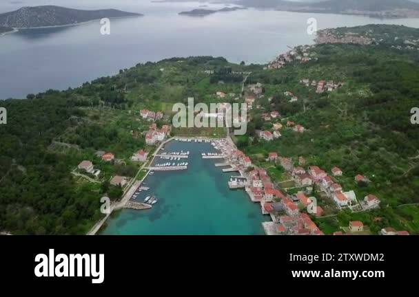 Aerial: Drone tilting up high over island Prvic in Croatia filming ...