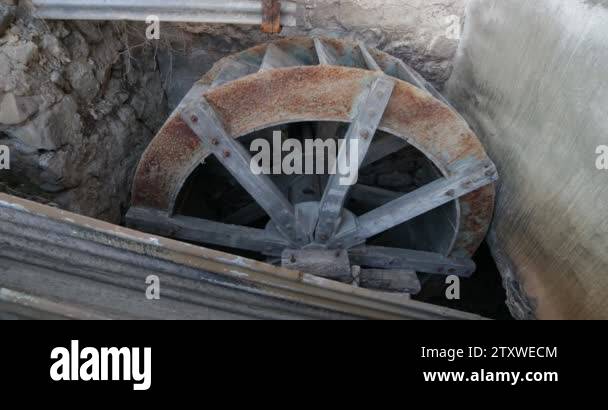 Detail of old abandoned water wheel of flour watermill. Wood structure ...