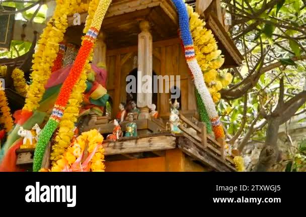 Wooden miniature guardian spirit house. Small buddhist temple shrine ...