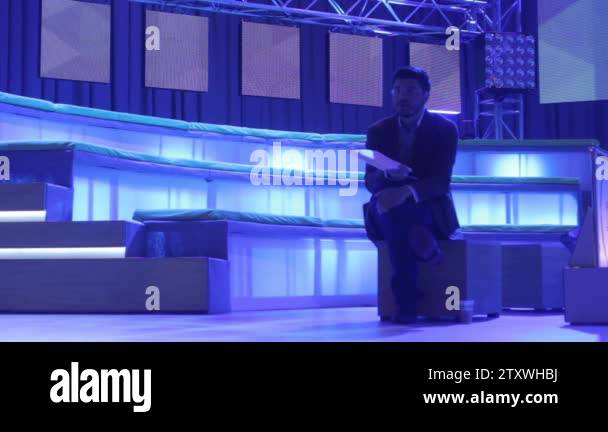 Male man TV presenter in a TV studio. TV presenter. TV host Stock Video ...