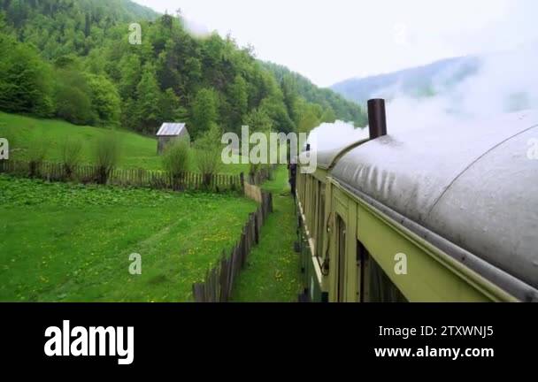 view from the roof of a retro train wagon, Old steam locomotive in ...