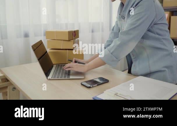 Beautiful smart Asian young entrepreneur business woman owner of SME ...