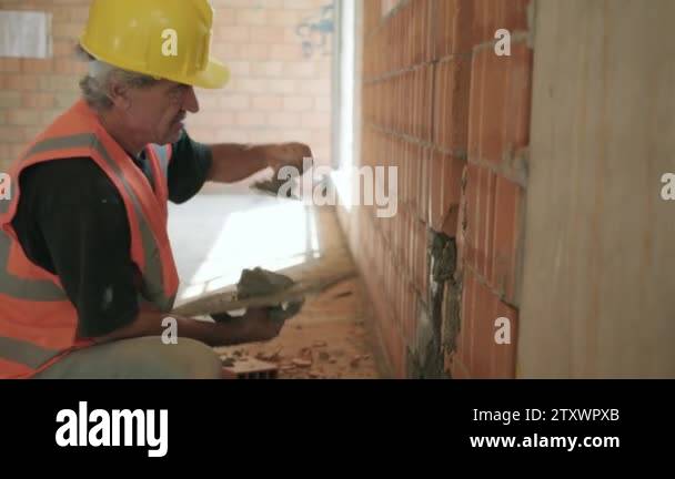 People working in construction site. Busy caucasian man at work in new ...