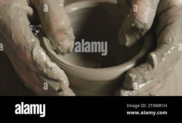 An expert potter, he creates with clay and his hands a beautiful vase ...