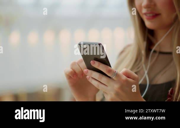 Girl use mobile phone, blur image of inside the mall as background ...