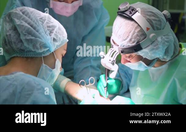 The surgeon is performing an operation on the eyes, close-up ...