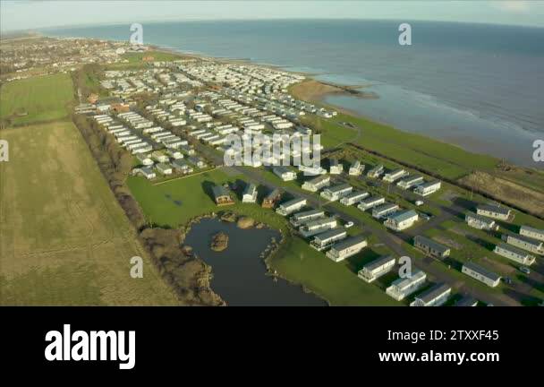 Aerial footage of stationary caravan holiday homes in a trailer park ...