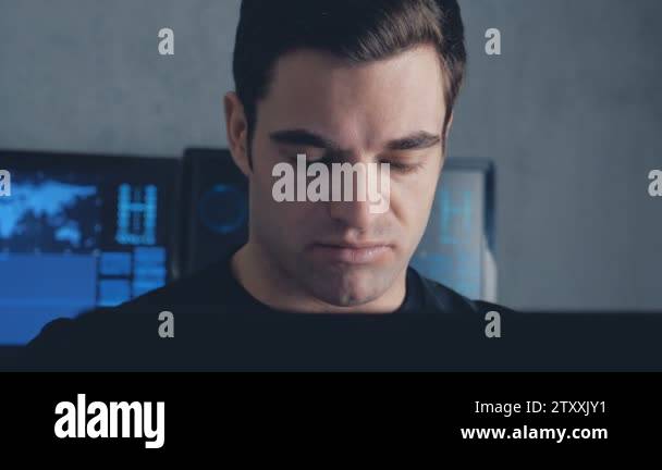 Developer Programmer Working On Computer In A Data Center Filled With Monitor Screens Steadicam