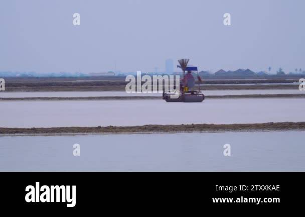 Salt farming, villager are using compact tractors to smooth the soil ...