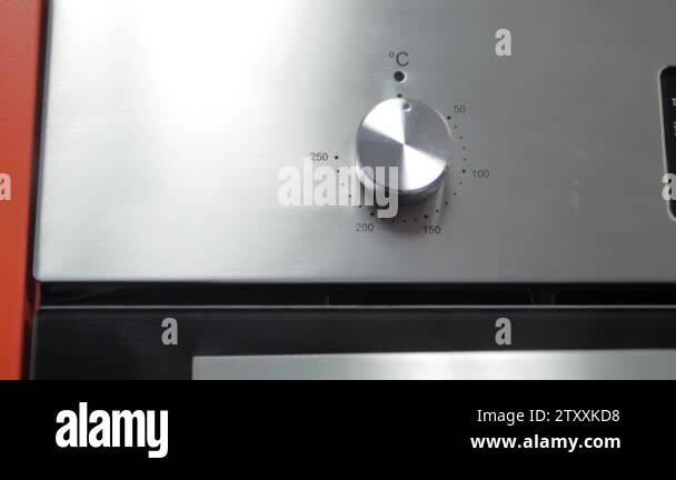 Metallic Toggle Switch of the Cooker Oven. Close-up View. Digital Clock ...