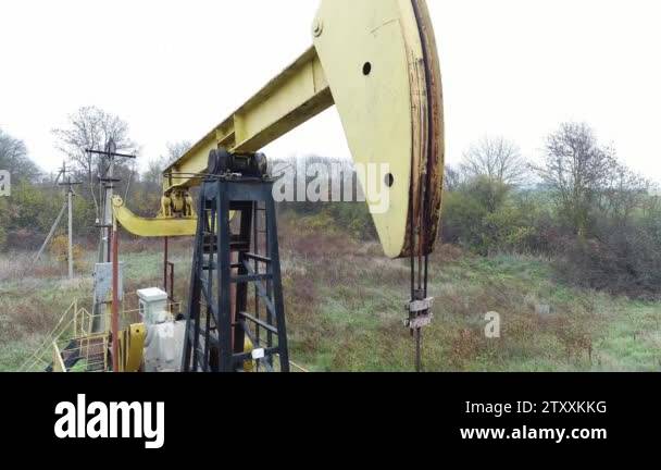 Oil pumping tower. Extraction of oil or gas using a pump rocking Stock ...
