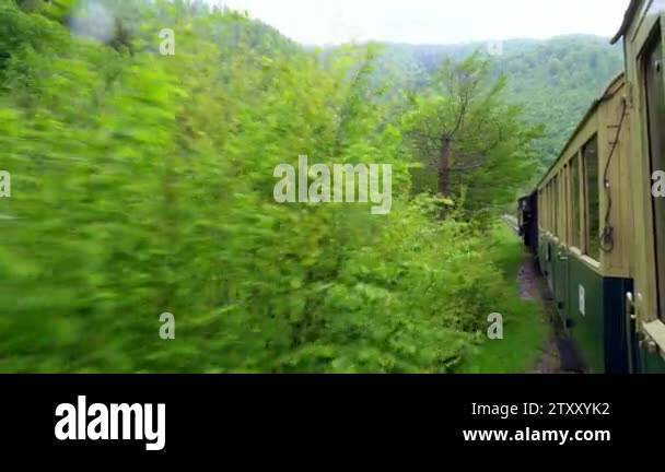 view from the roof of a retro train wagon, Old steam locomotive in ...