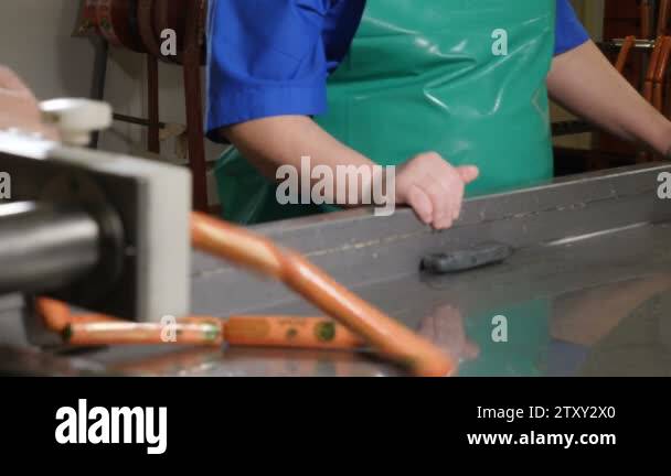 Industrial sausages production process at meat and sausage making plant ...