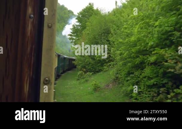 view from the window of a retro train wagon, Old steam locomotive in ...