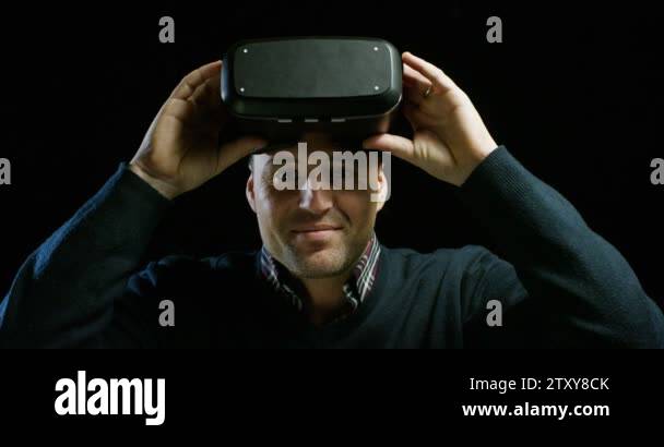 young nice man using 3d reality in life with oculus and augmented ...