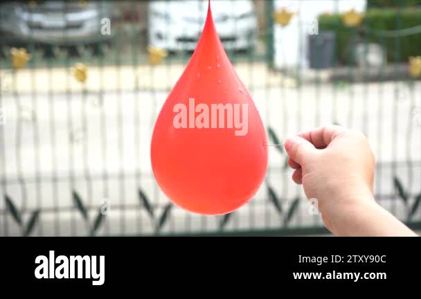 Broken water balloon Stock Videos & Footage - HD and 4K Video Clips - Alamy