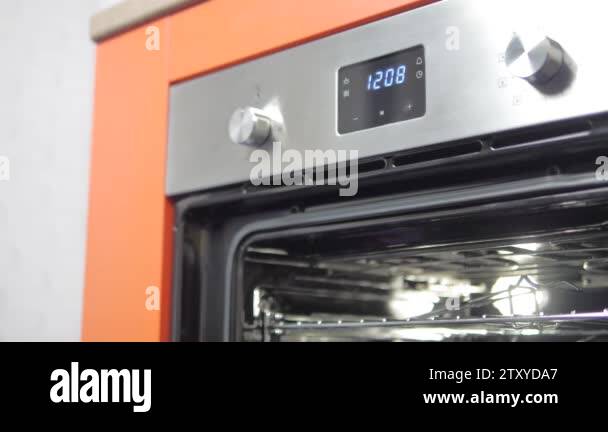 Metallic Toggle Switch of the Cooker Oven. Close-up View. Digital Clock ...