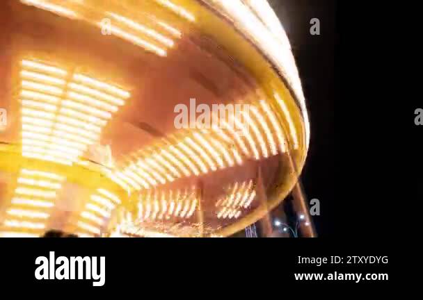 Merry-go-round carousel at night. Amusement park carousel with ...