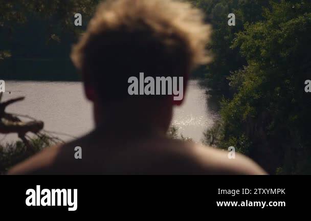 backside view on happy man looking on lake and nature in 4k Stock Video ...