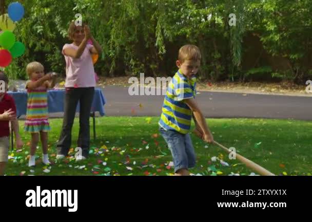 Boy hitting a pinata Stock Video Footage - Alamy
