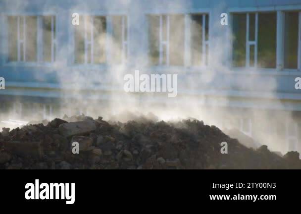 Concept of the breakthrough of underground utilities. steam breaks out ...