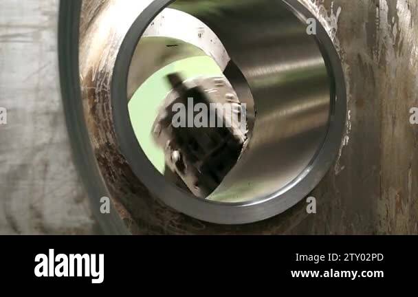 huge lathe closeup, large spindle lathe is rotating at an industrial ...