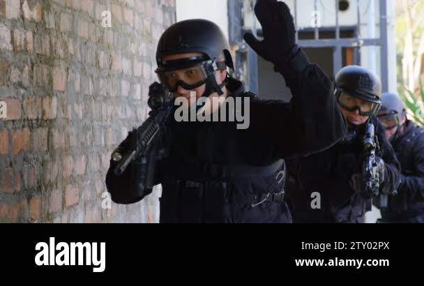 Front view of caucasian soldiers conduct military exercise at military ...