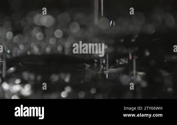 Fabulous dots of rainy water shining on a cave land with strange dots ...