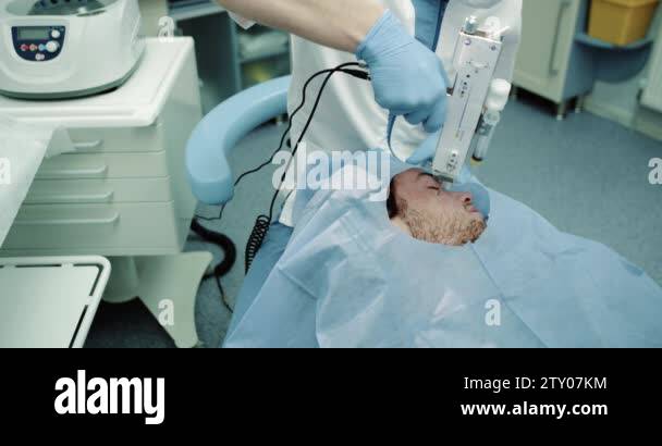 Young patient in a modern clinic have a face modern procedure with a ...