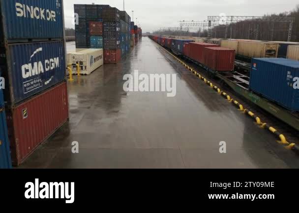 The fly of the camera over the cargo terminal: visible railway tracks ...