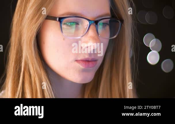 Reflection of green screen in spectacles on caucasian blonde female ...