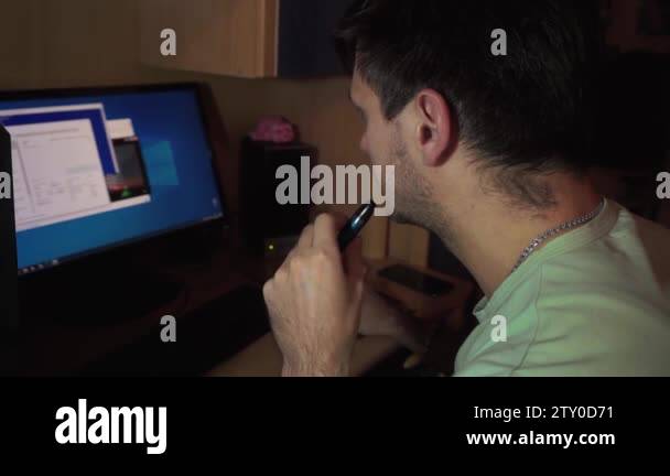 Guy sitting on monitor Stock Videos & Footage - HD and 4K Video Clips ...