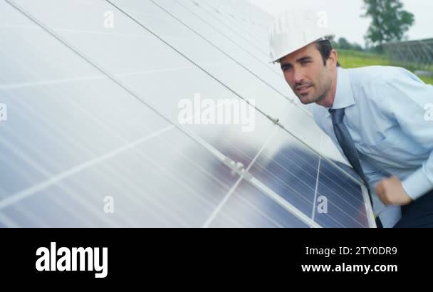 video of man checking eco solar panels, roof cells solar system station ...