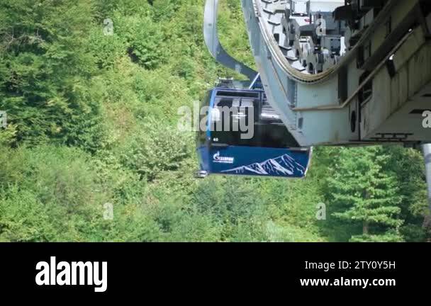 Cable car cabins moving on rope way for passenger transportation across ...