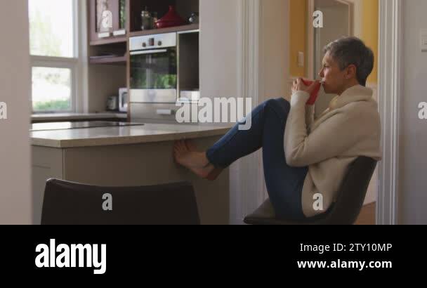 Side view of a senior Caucasian woman with short grey hair in her ...