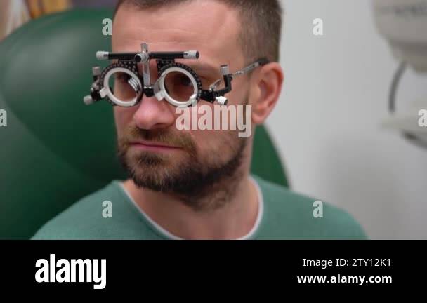 Man at the reception of an ophthalmologist. Eye examination and ...