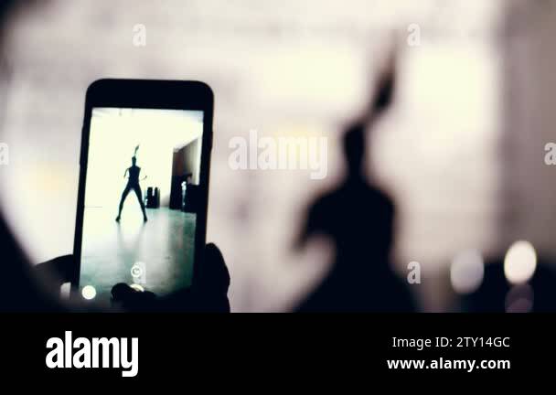 close-up, smartphone monitor, shooting a dark figure, outline of a ...