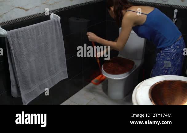 Woman washes the floor with a mop around the toilet Stock Video Footage ...