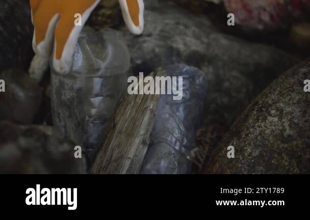 A shot from left to right showing the plastic waste scattered on the ...